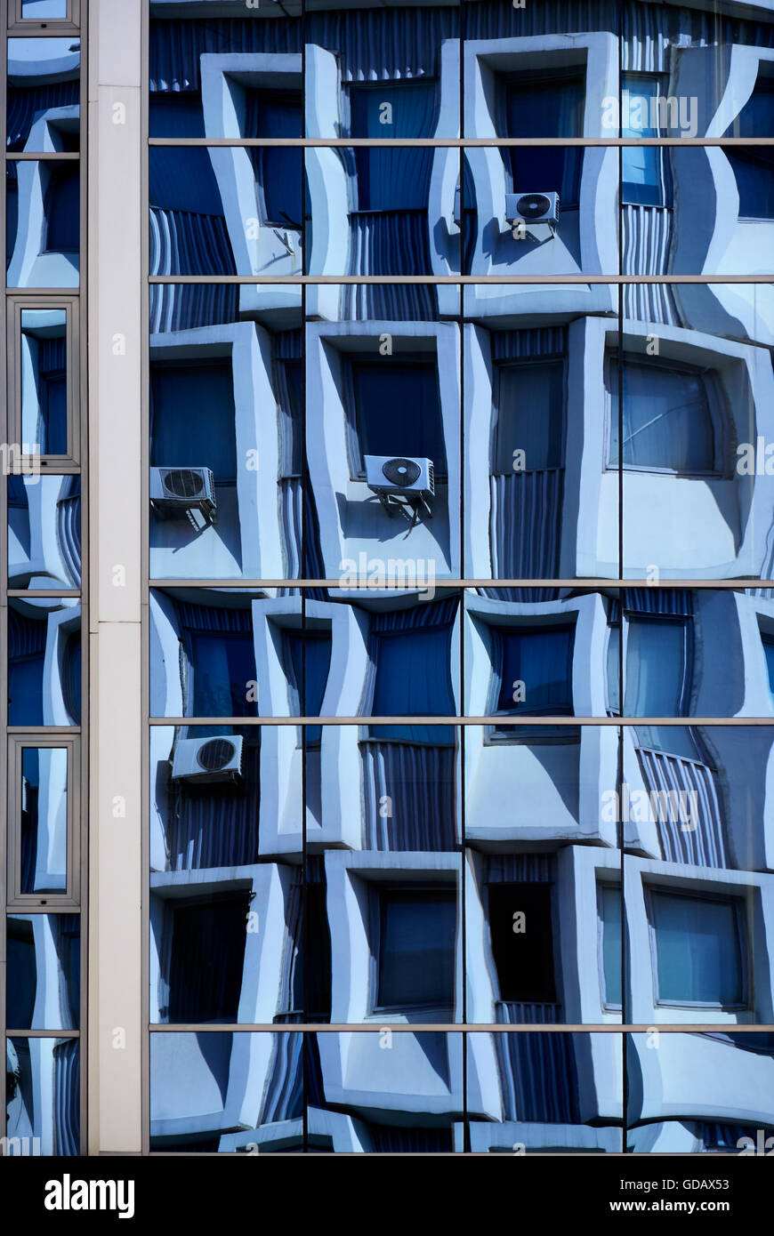 Textures and backgrounds: distorted reflection in blue glass building ...