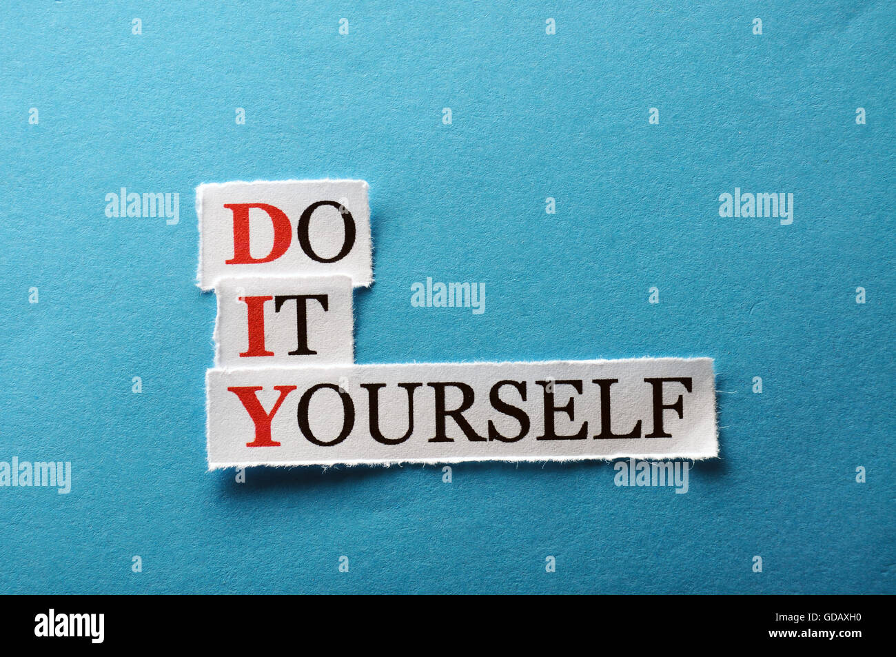 DIY Do It Yourself, words on cut paper hard light Stock Photo - Alamy