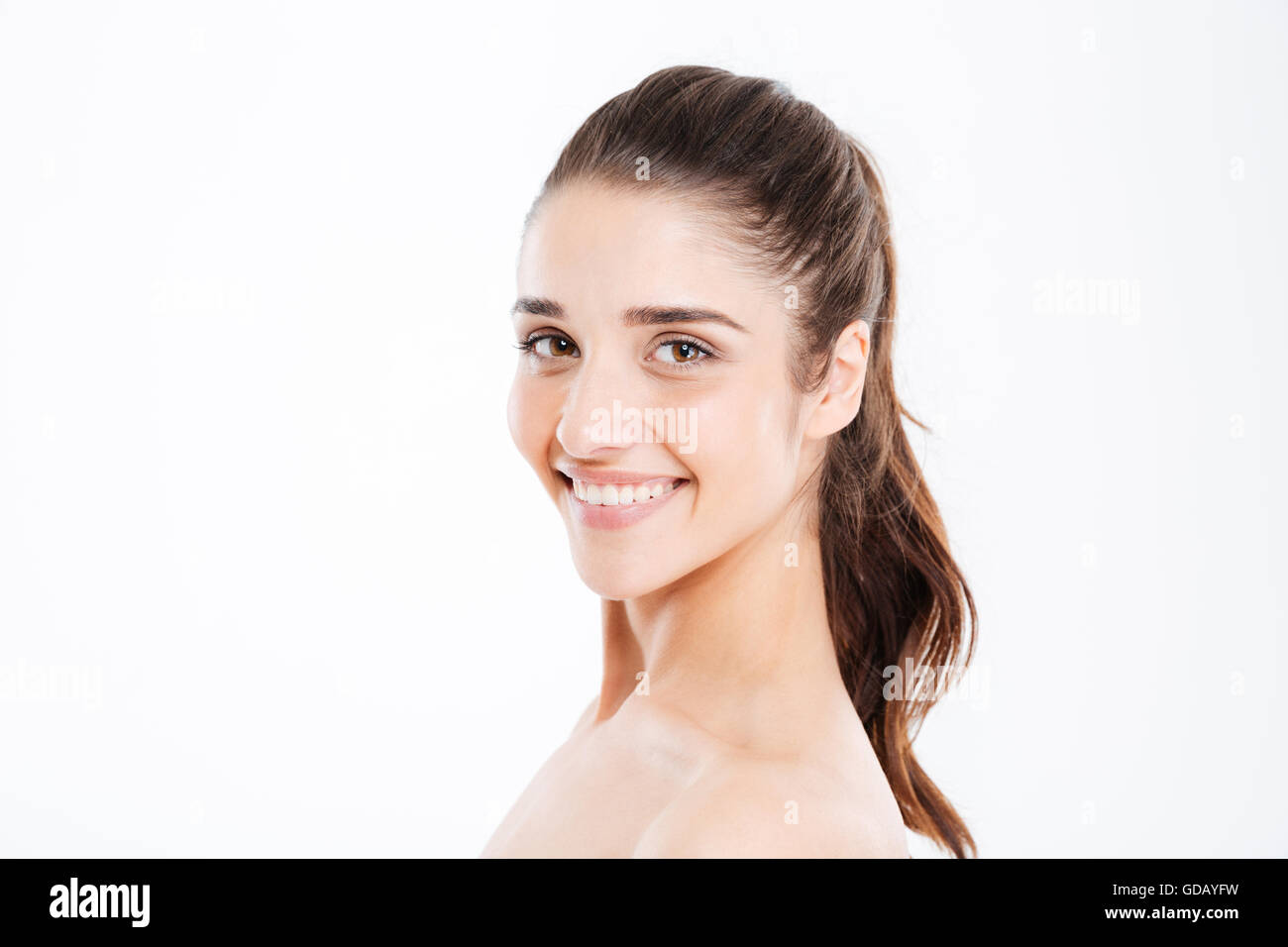 Beauty Portrait Of Smiling Young Woman Looking At Camera Over White
