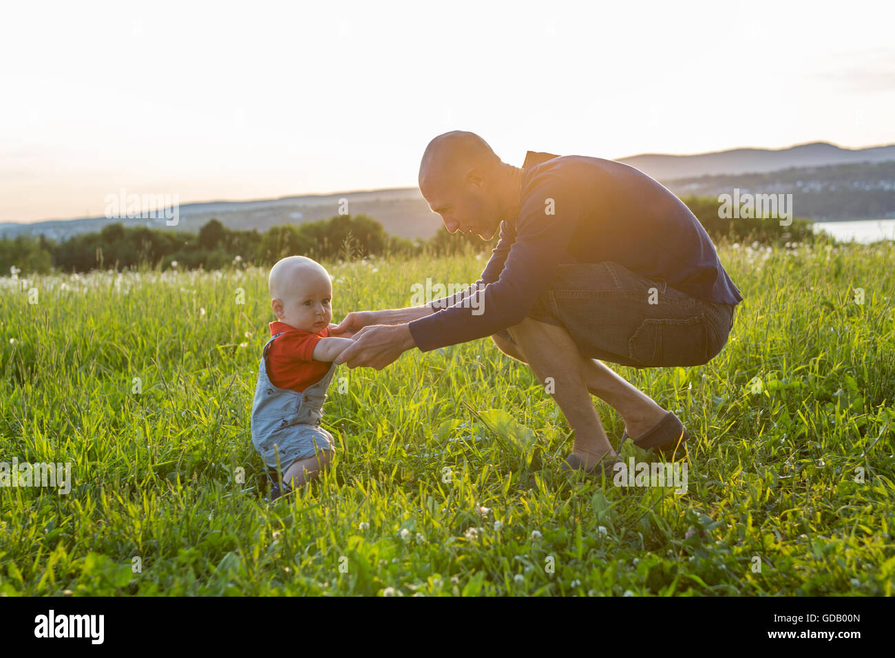 Baby with sunset hi-res stock photography and images - Alamy