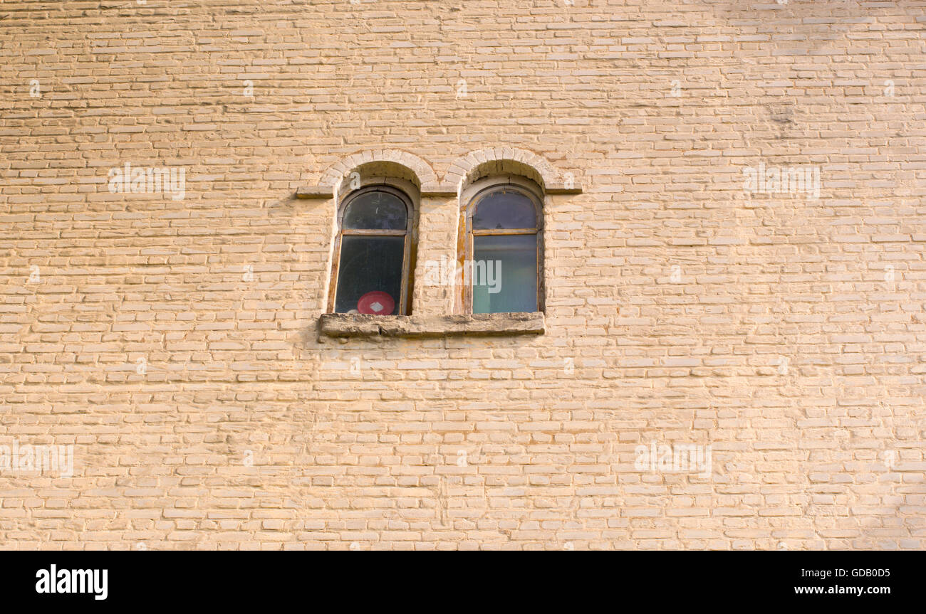 Two windows at background of brick wall Stock Photo - Alamy