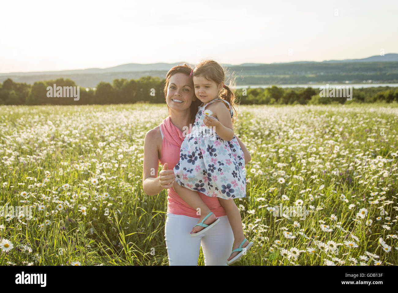 Happy joyful mother daughter daisy hi-res stock photography and images ...
