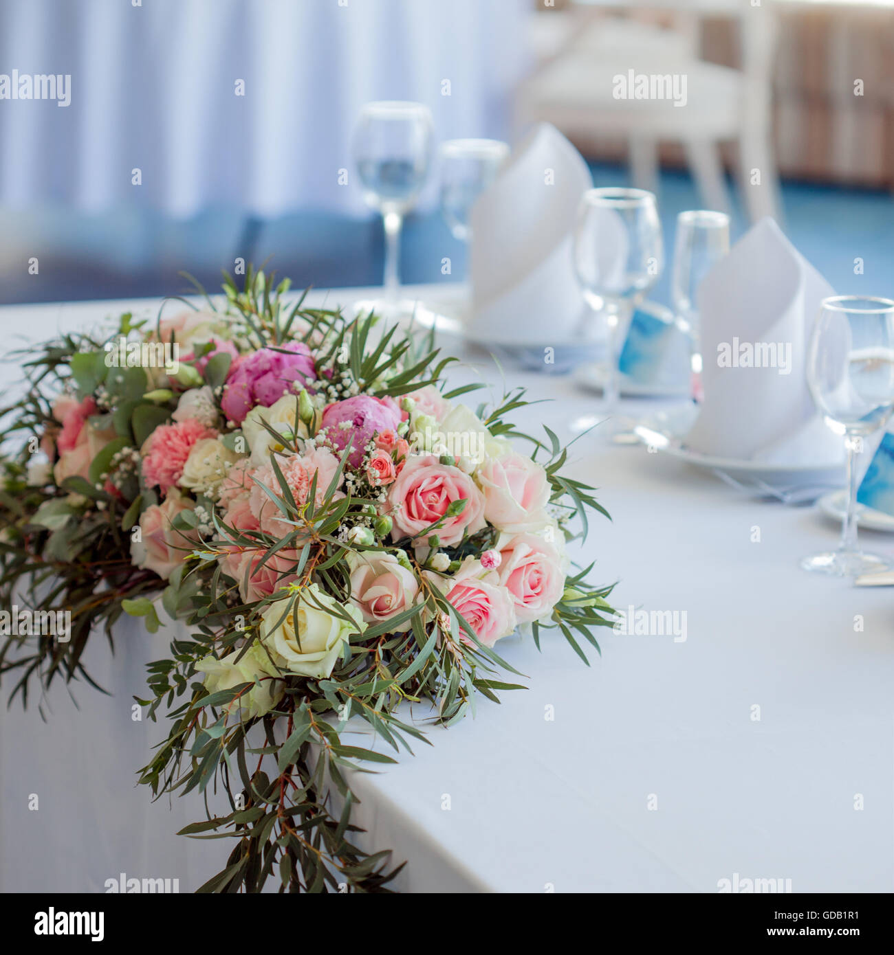 Table set for an event party or wedding reception. Large floral ...