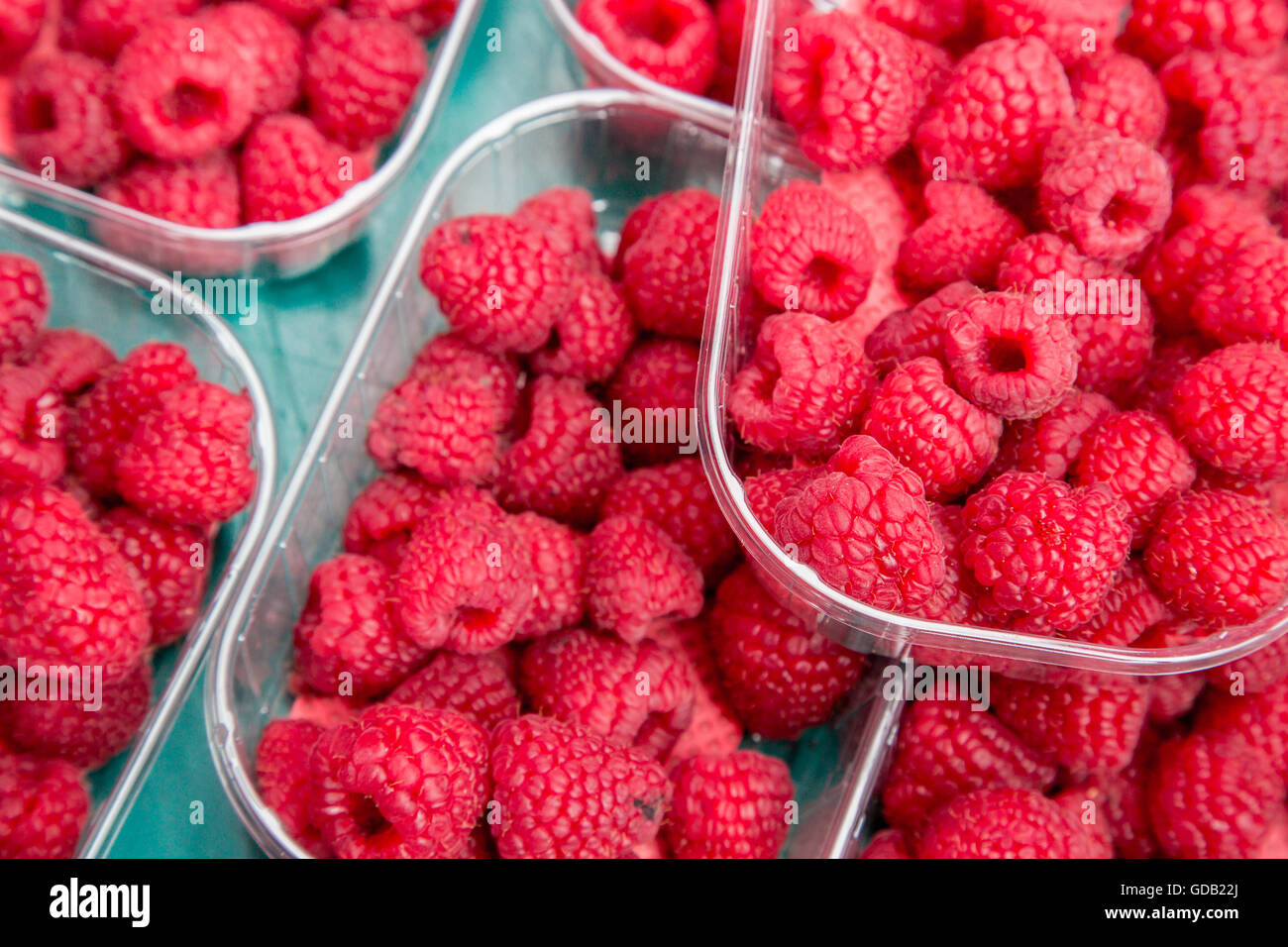 Ripe juicy raspberry in boxes hi-res stock photography and images - Alamy