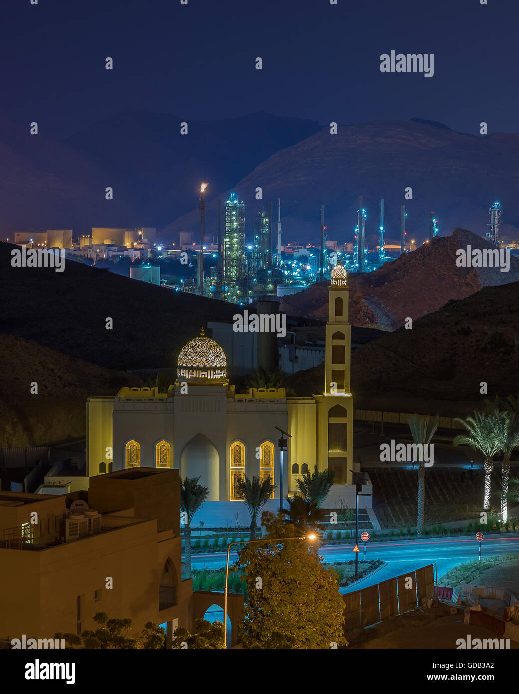 Mosque with refinery in background,PDO, Muscat, Oman Stock Photo - Alamy
