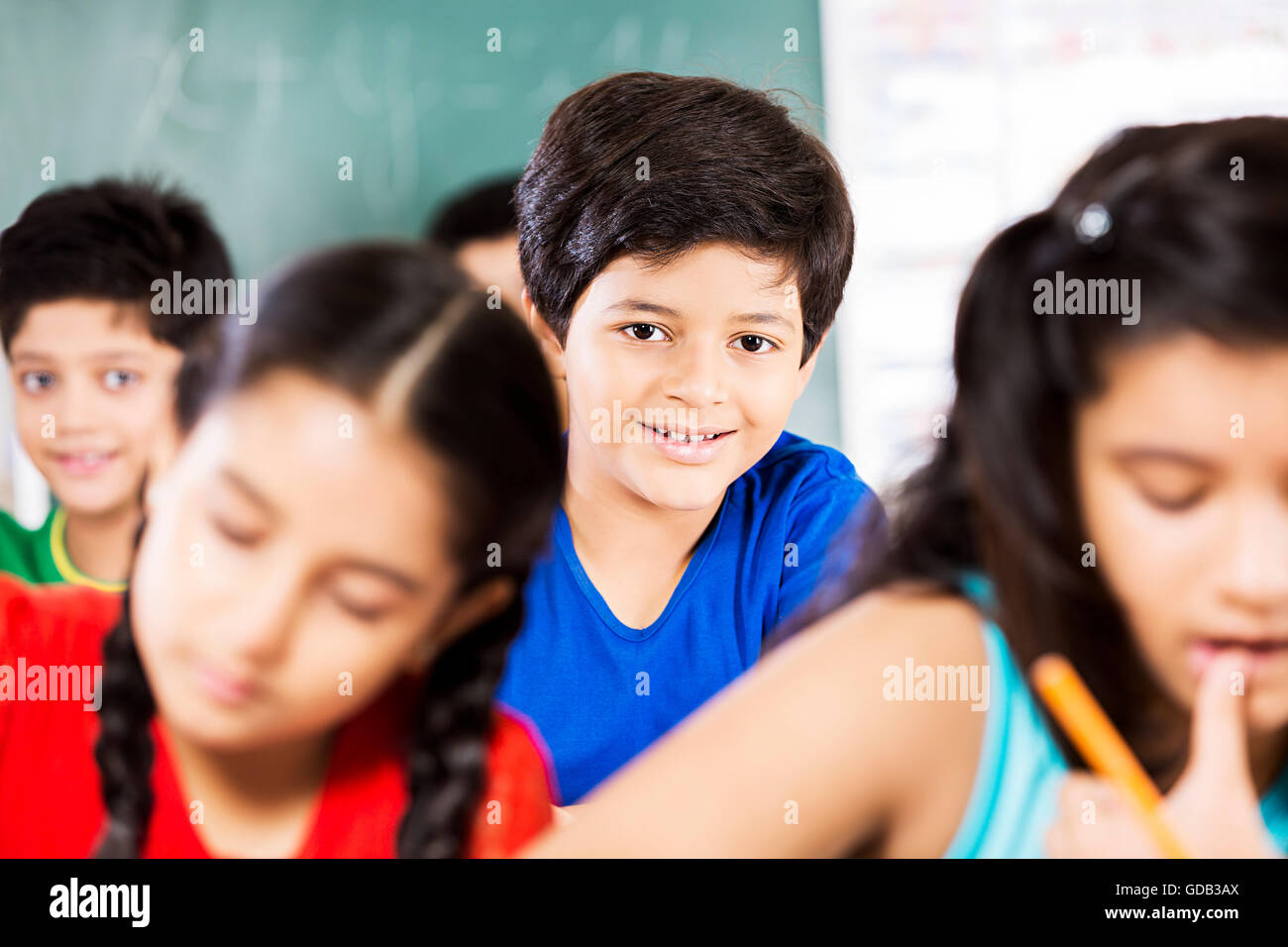 3 kids Girls and Boy School Student Studying in a Classroom Stock Photo ...