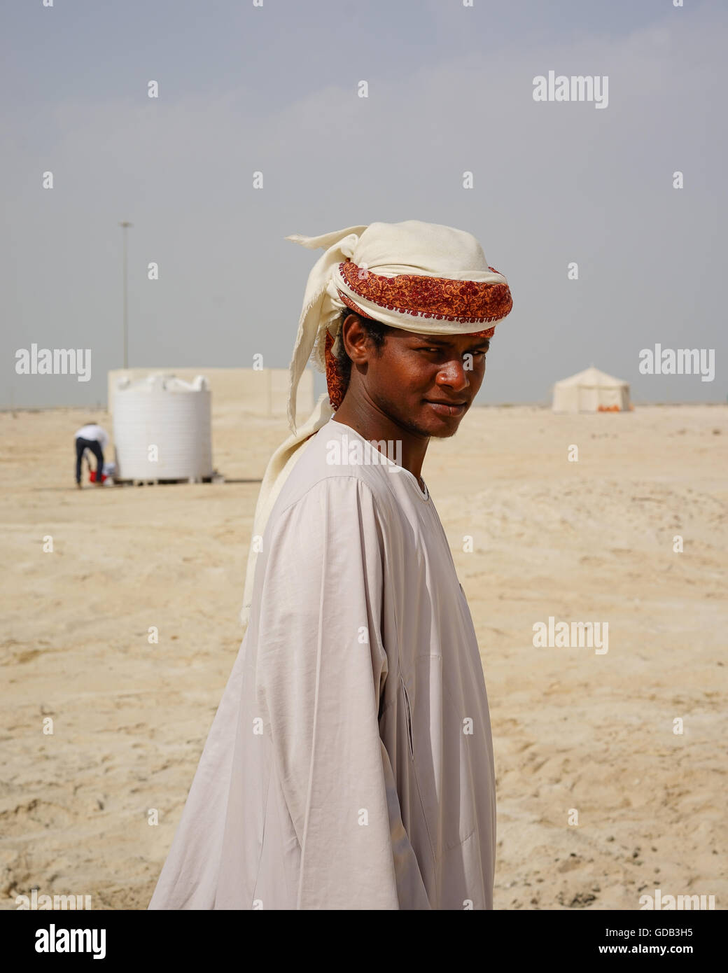 Camel herder at the Al Galayel Hunting Festival in Qatar. The annual ...