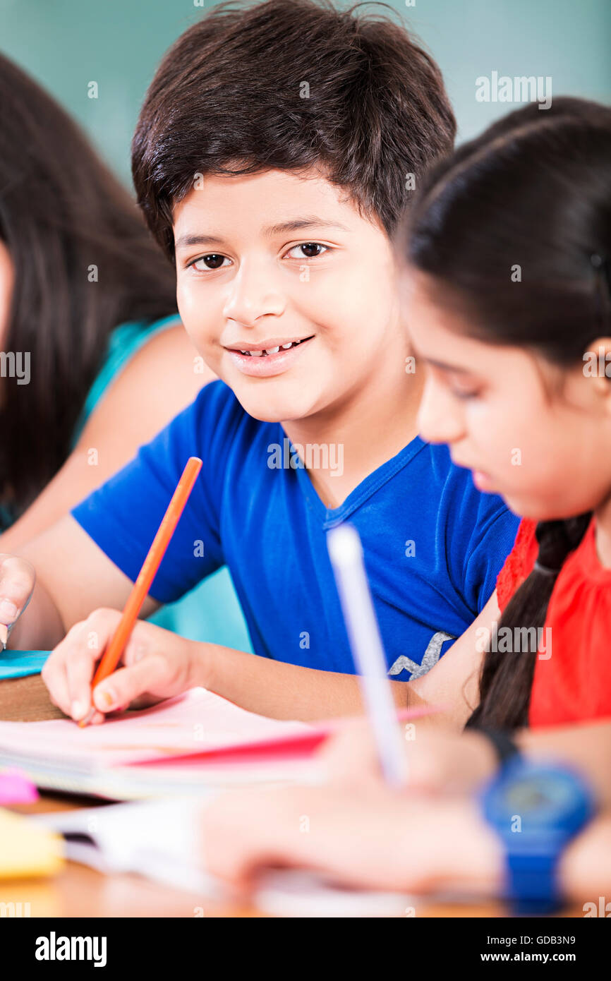 2 kids Girl and Boy School Student Studying in a Classroom Stock Photo ...