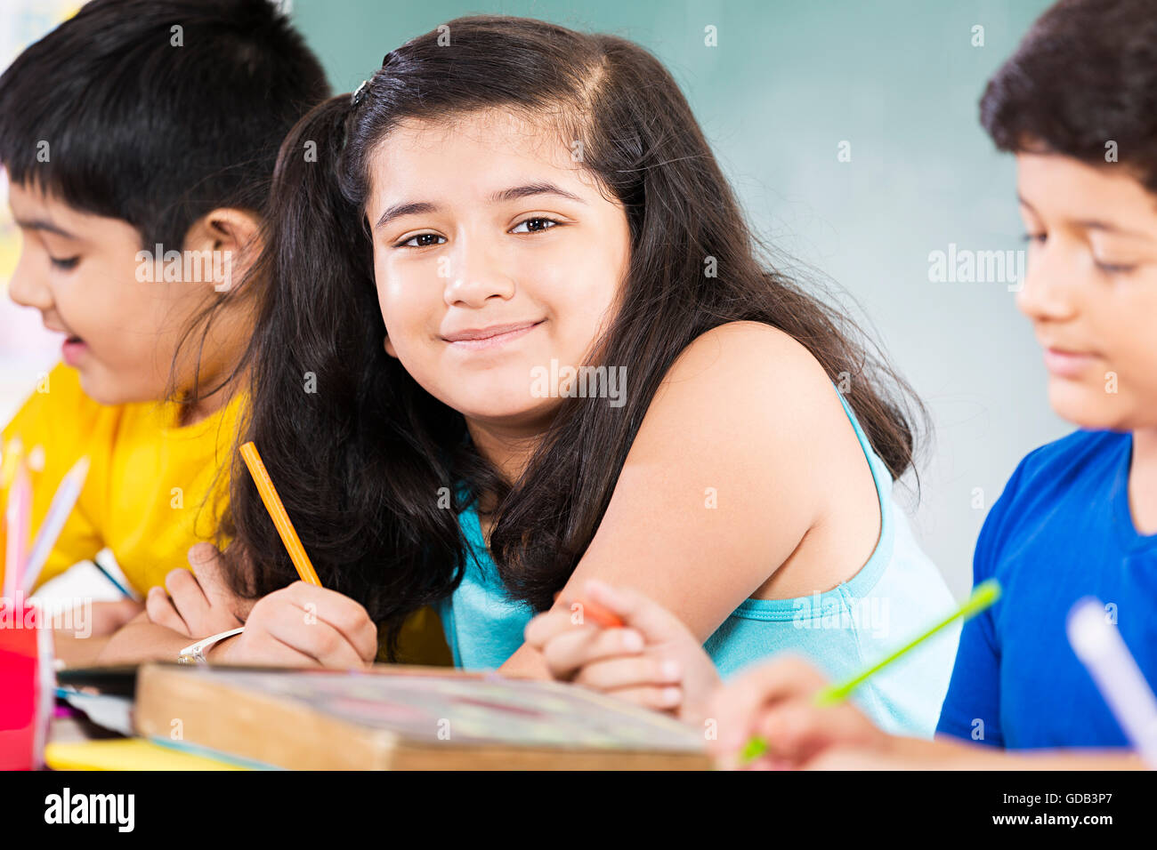 3 kids Girl and Boys School Student Studying in a Classroom Stock Photo ...