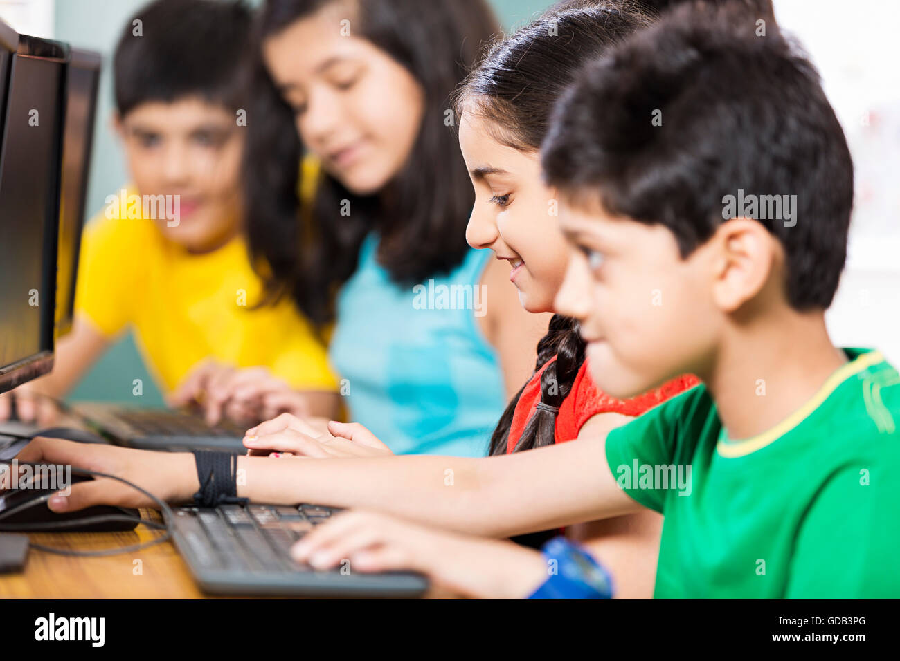 4 kids Girls and Boys School Student Sitting Classroom Computer ...