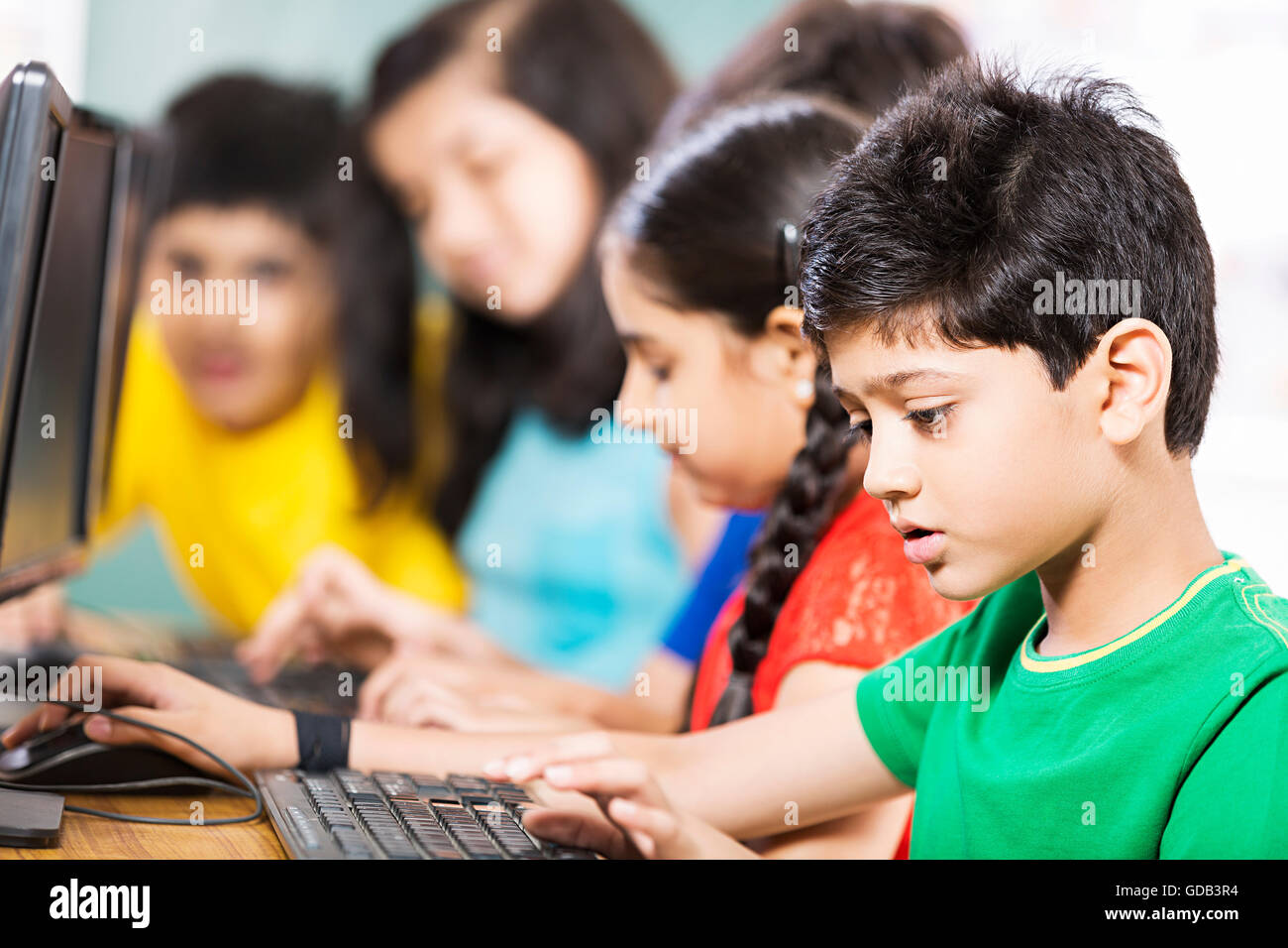 4 kids Girls and Boys School Student Sitting Classroom Computer ...