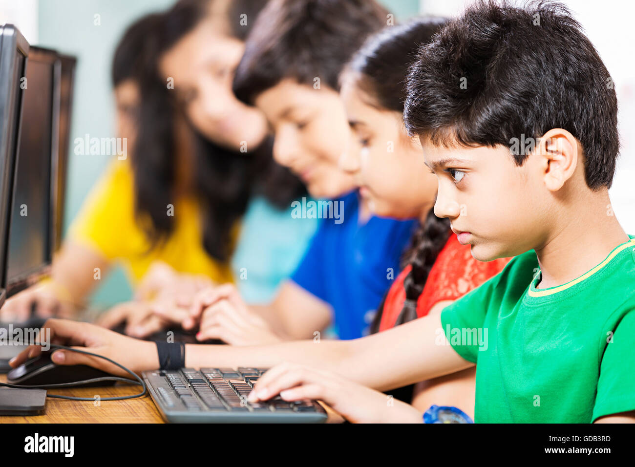 5 kids Girls and Boys School Student Sitting Classroom Computer ...
