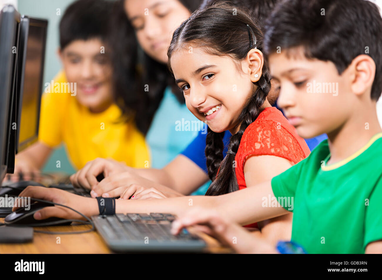 5 kids Girls and Boys School Student Sitting Classroom Computer ...