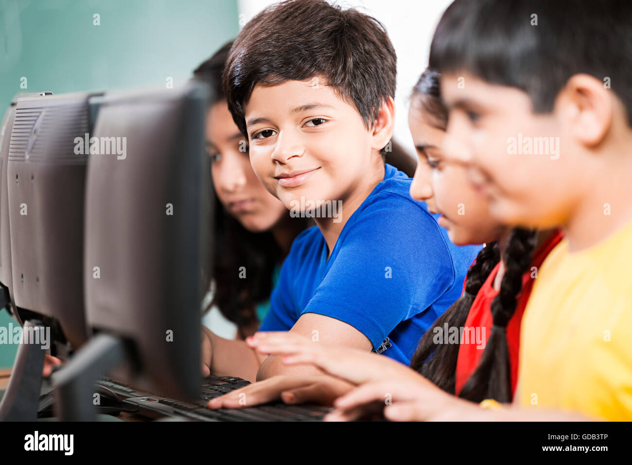 4 kids Girls and Boys School Student Sitting Classroom Computer ...