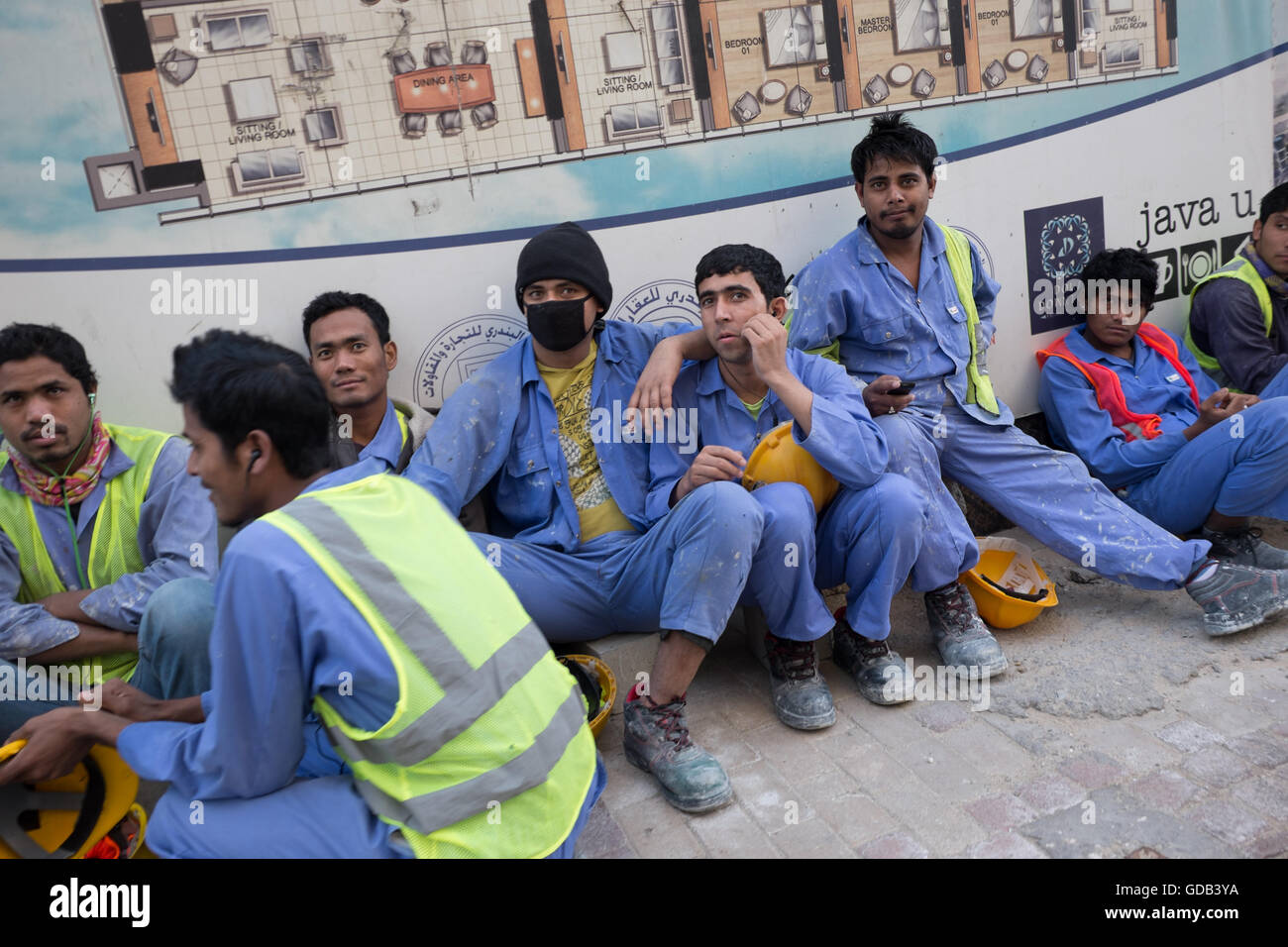 Construction workers resting in Doha, Qatar Stock Photo - Alamy