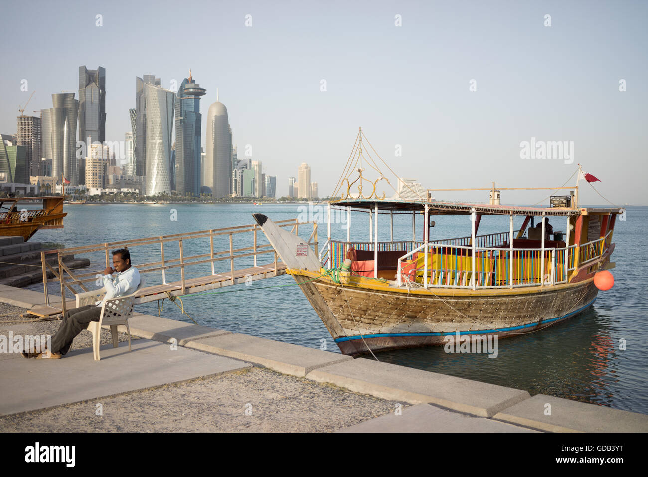 Traditional dhow operator touts for business along Doha's corniche ...