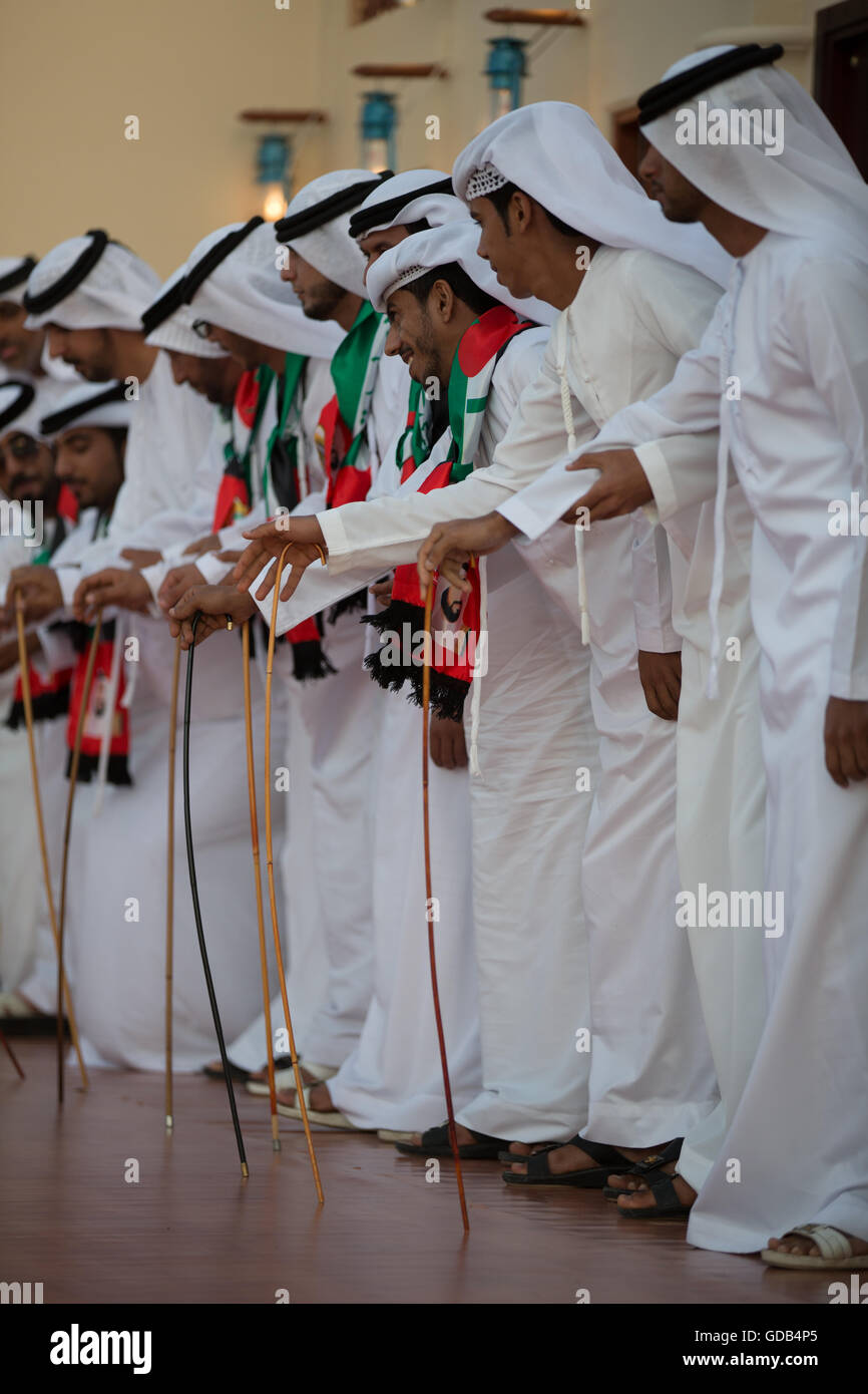 Emirati men doing a traditional dance called Farga Harbia at the ...