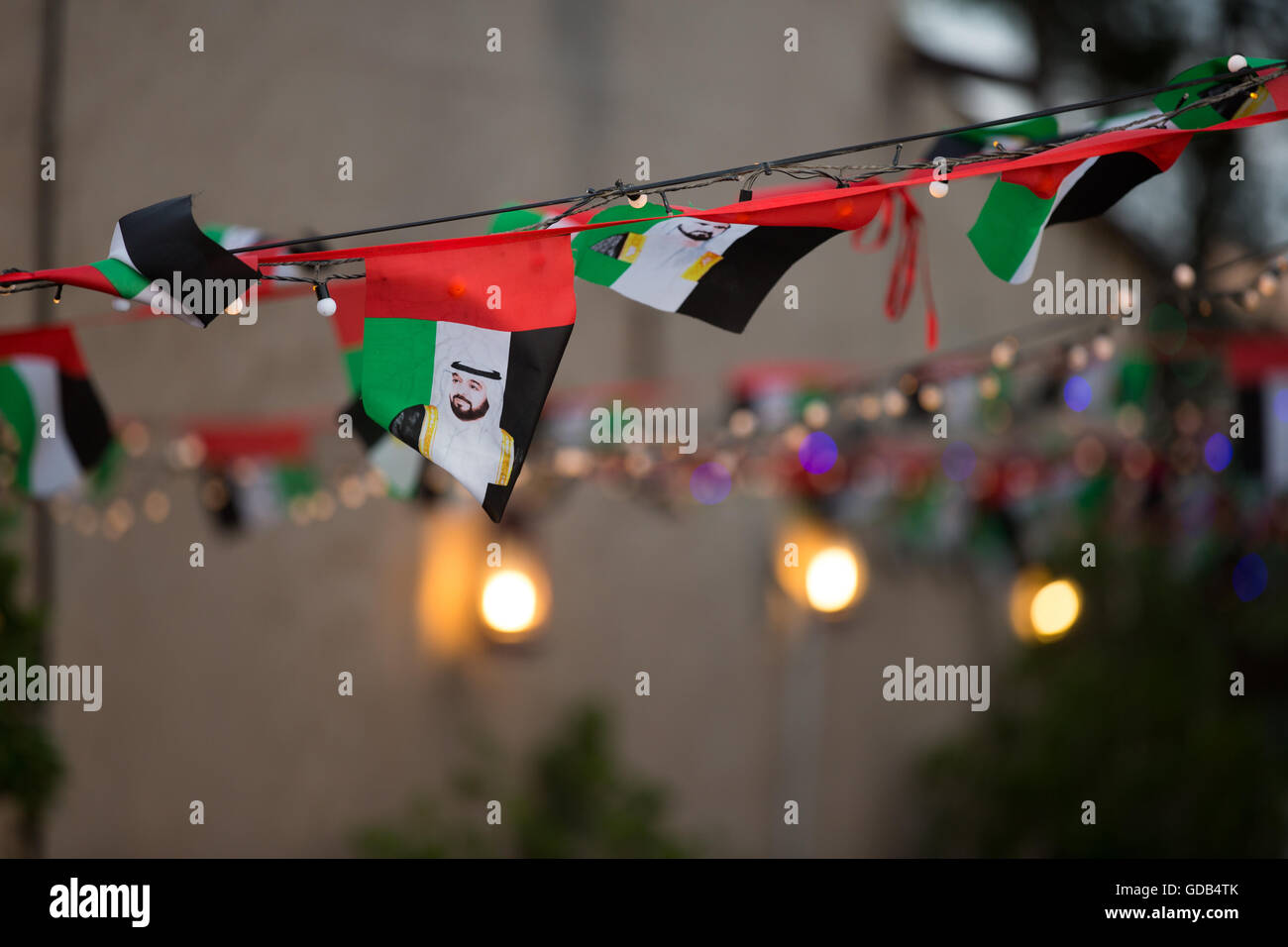 Emirati National Day flag bunting shows the UAE flag with a photograph ...