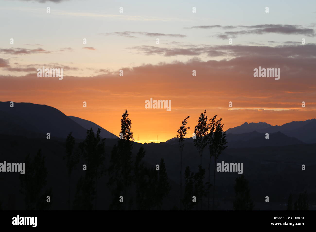 Sunset inn mountains Stock Photo - Alamy