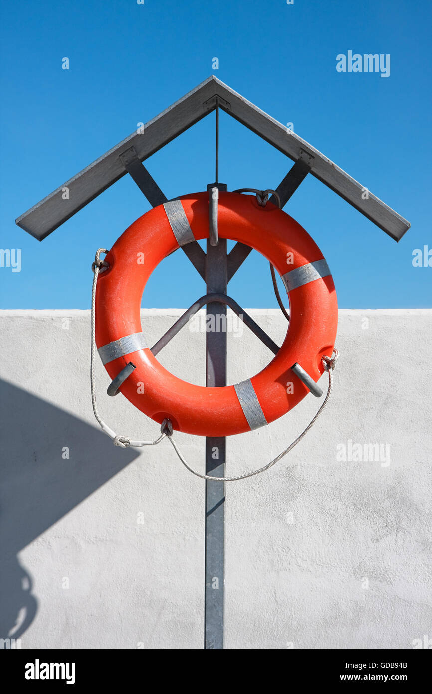 Lifebuoy hanging on a rack Stock Photo - Alamy