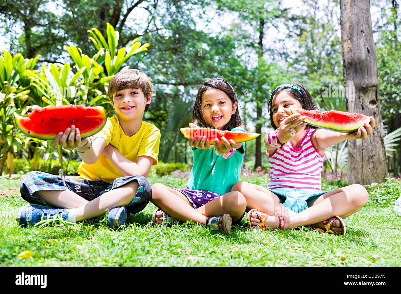 Boy girl watermelon garden hi-res stock photography and images - Alamy