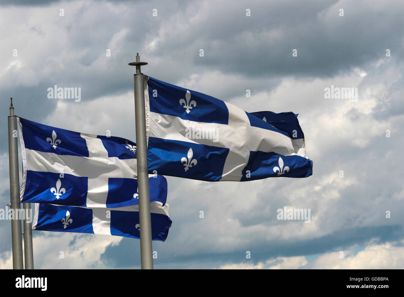 Quebec flags blow in the wind at Olympic Stadium in Montreal, Que ...