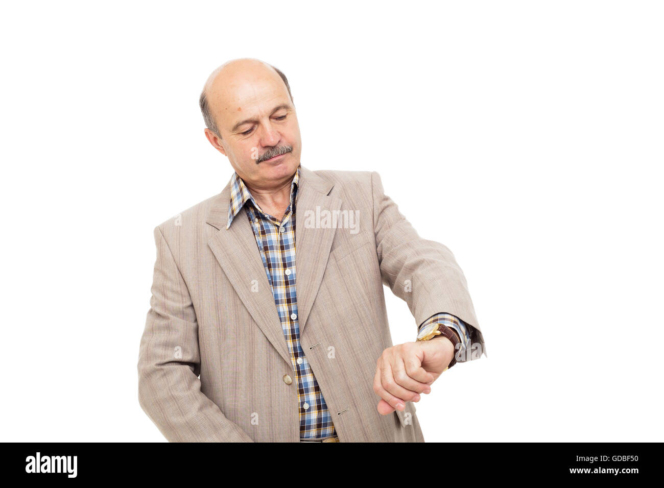 Man in suit waiting and looking on hand clock Stock Photo - Alamy