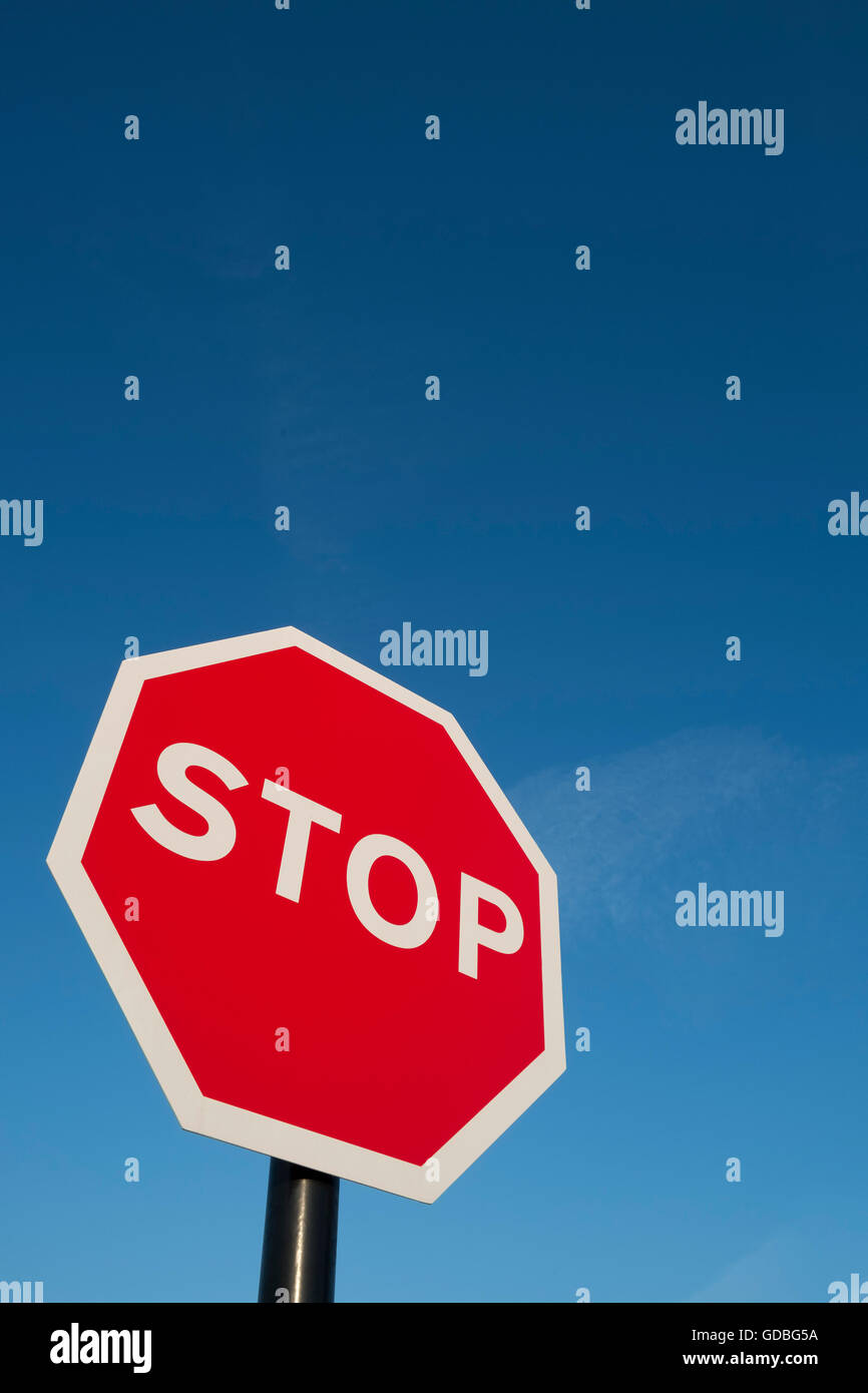 Red stop sign with a blue sky Stock Photo - Alamy
