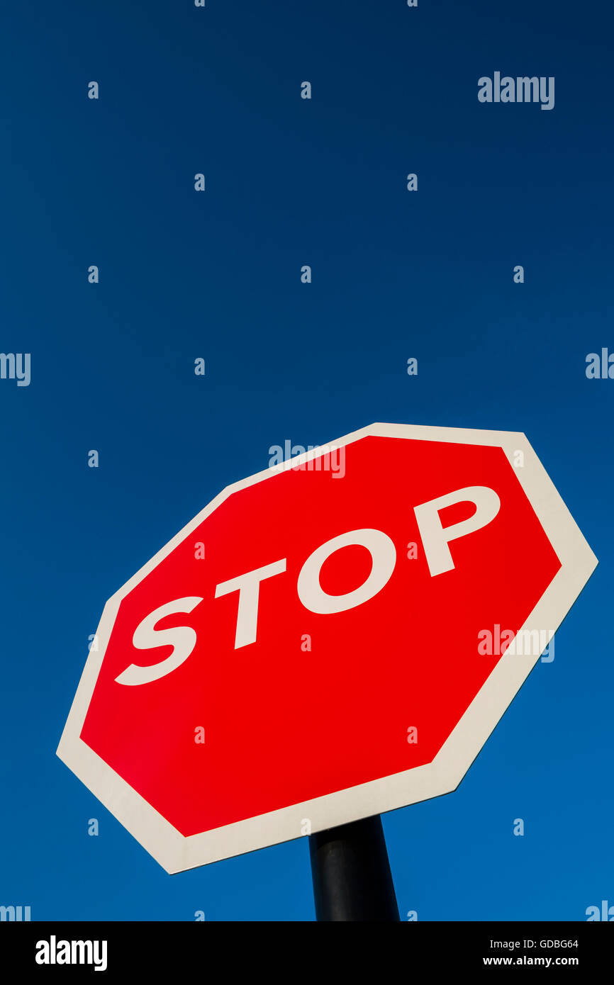 Red stop sign with a blue sky Stock Photo - Alamy