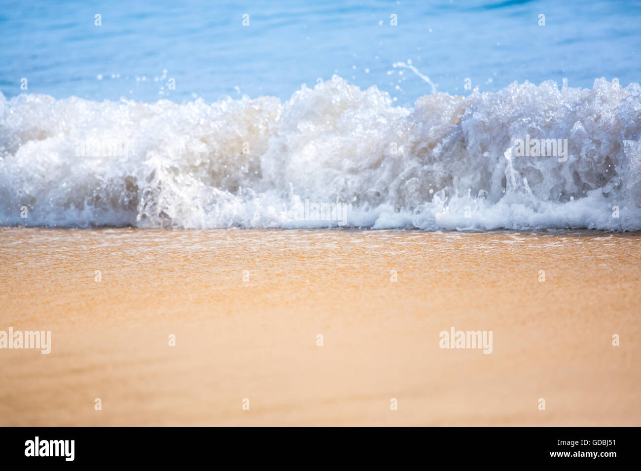 Sunset reflection on beach Stock Photo - Alamy