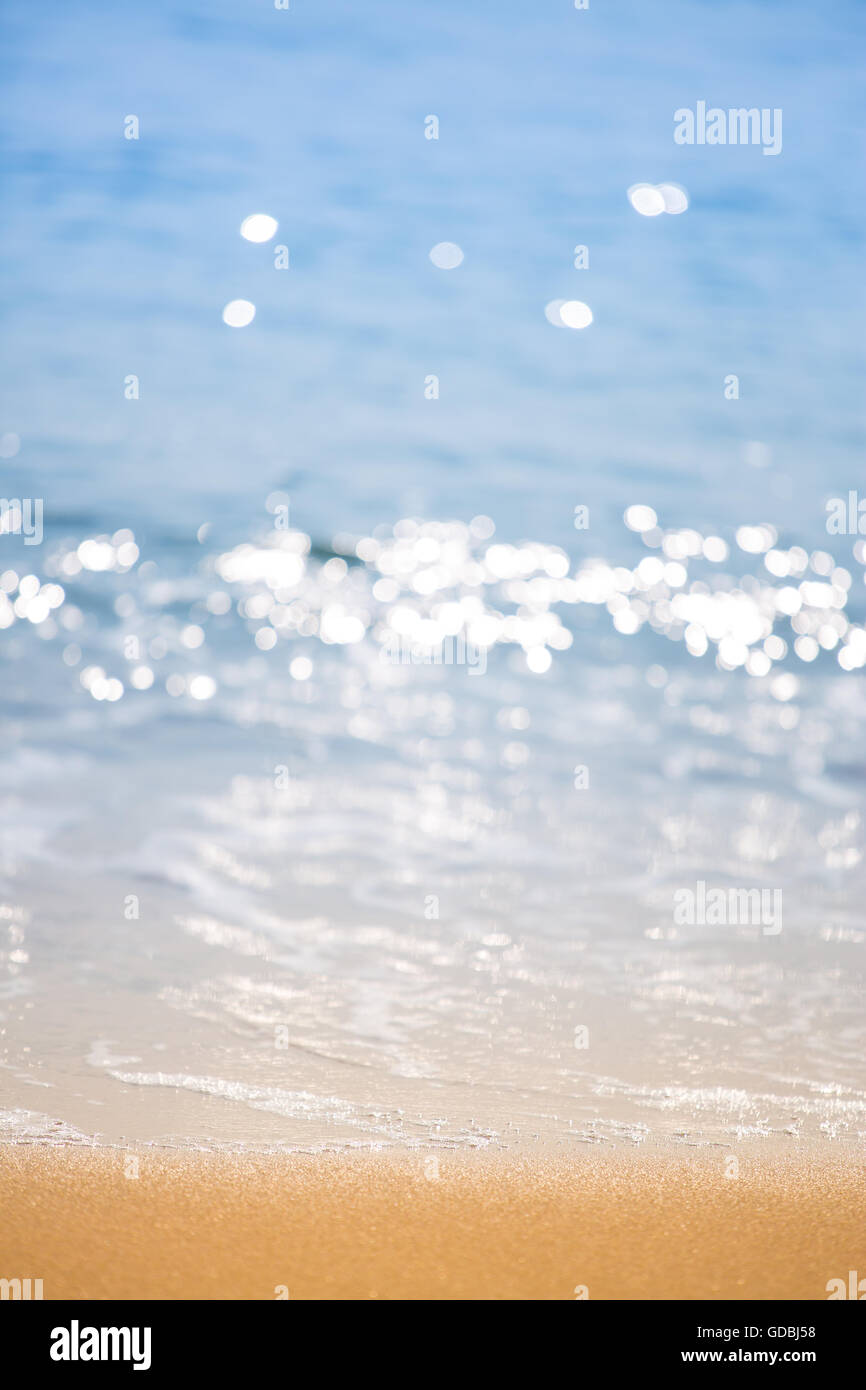 Sunset reflection on beach Stock Photo - Alamy