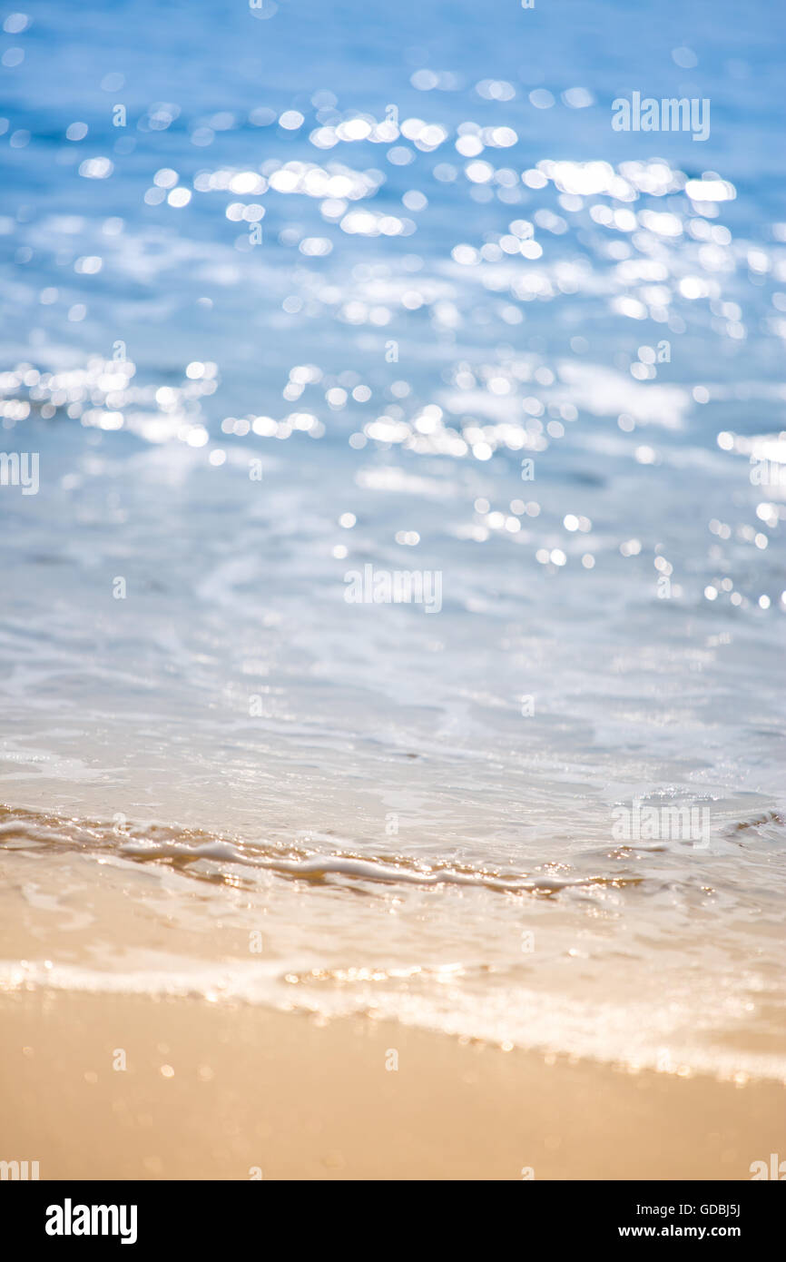 Sunset reflection on beach Stock Photo - Alamy