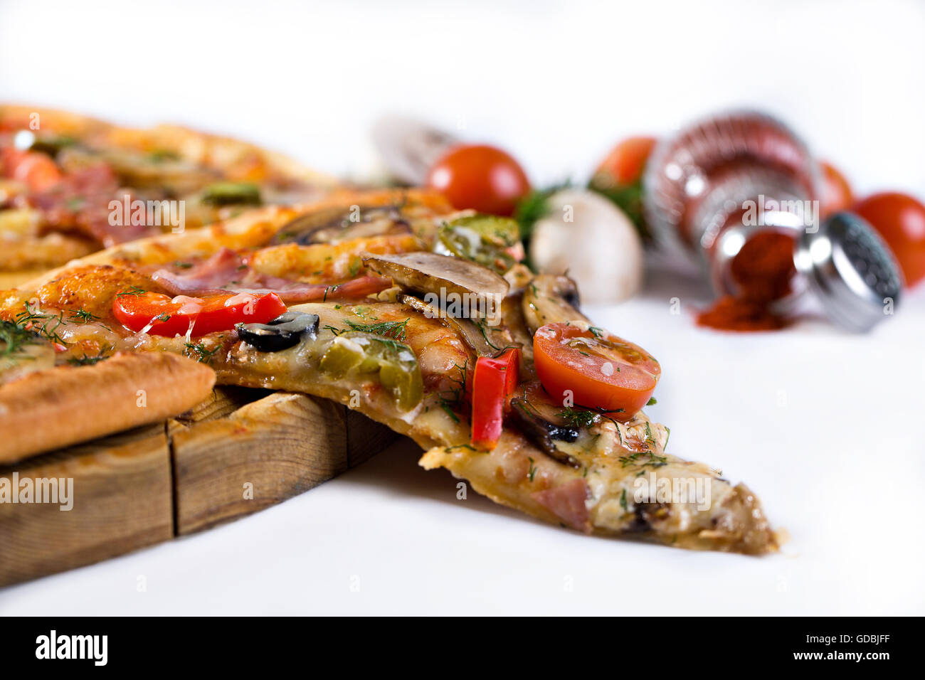Delicious italian pizza served on wooden table Stock Photo - Alamy