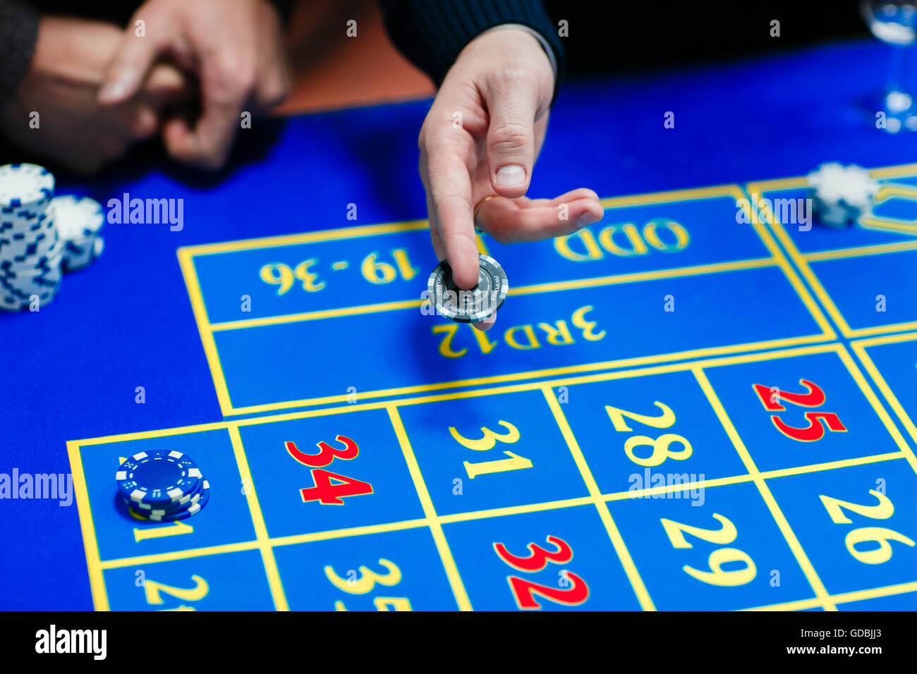 green roulette table with colored chips ready to play Stock Photo - Alamy