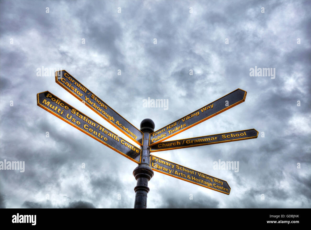 Directions sign pointing way to destinations typical town information ...