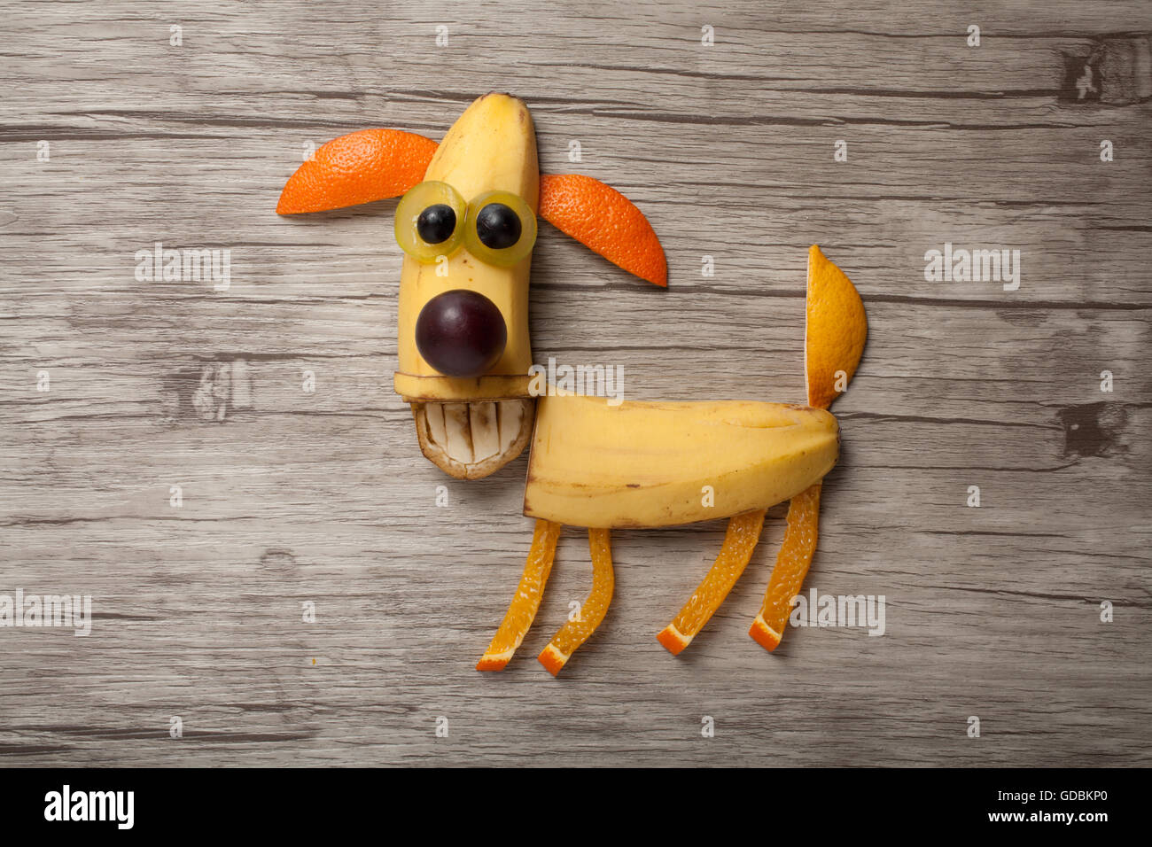 Dog made of fruits on wooden board Stock Photo - Alamy