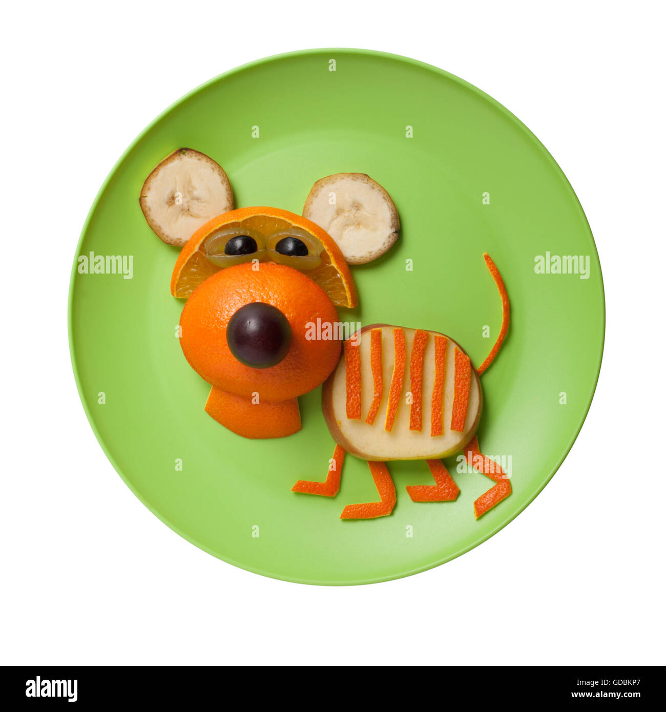 Tiger made of fruits on green plate Stock Photo - Alamy
