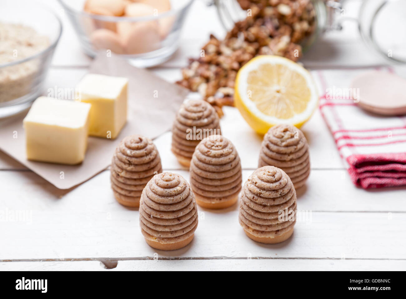 Traditional bee nest cake and ingredients on wooden background Stock ...