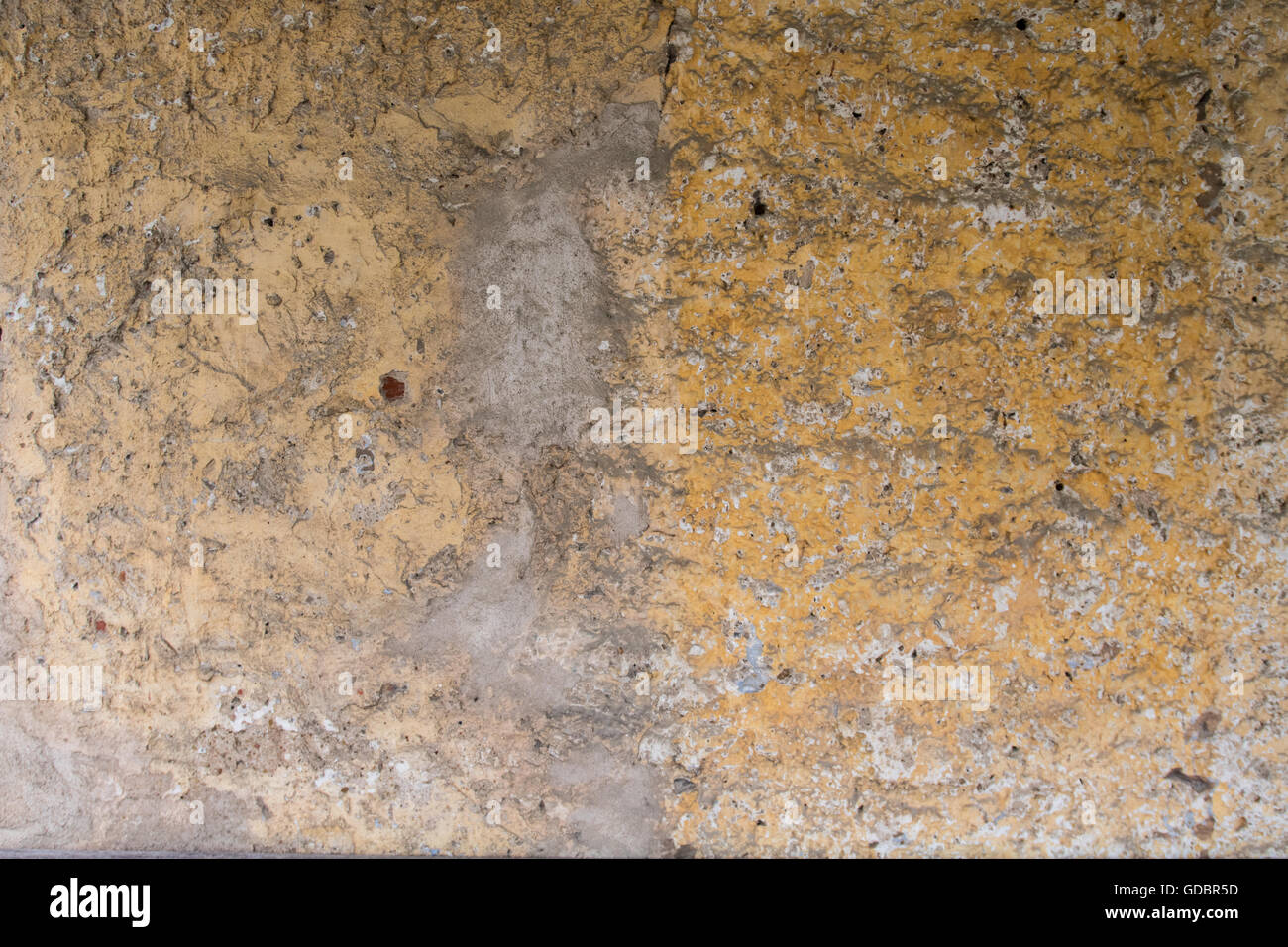 Gray Patch in Orange Painted Wall with white underneath Stock Photo - Alamy