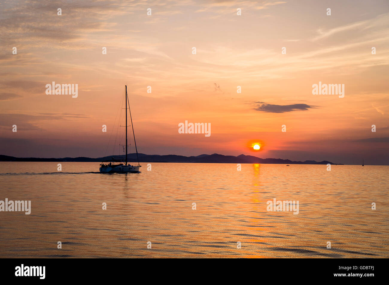yacht, sea, Sun set Stock Photo - Alamy
