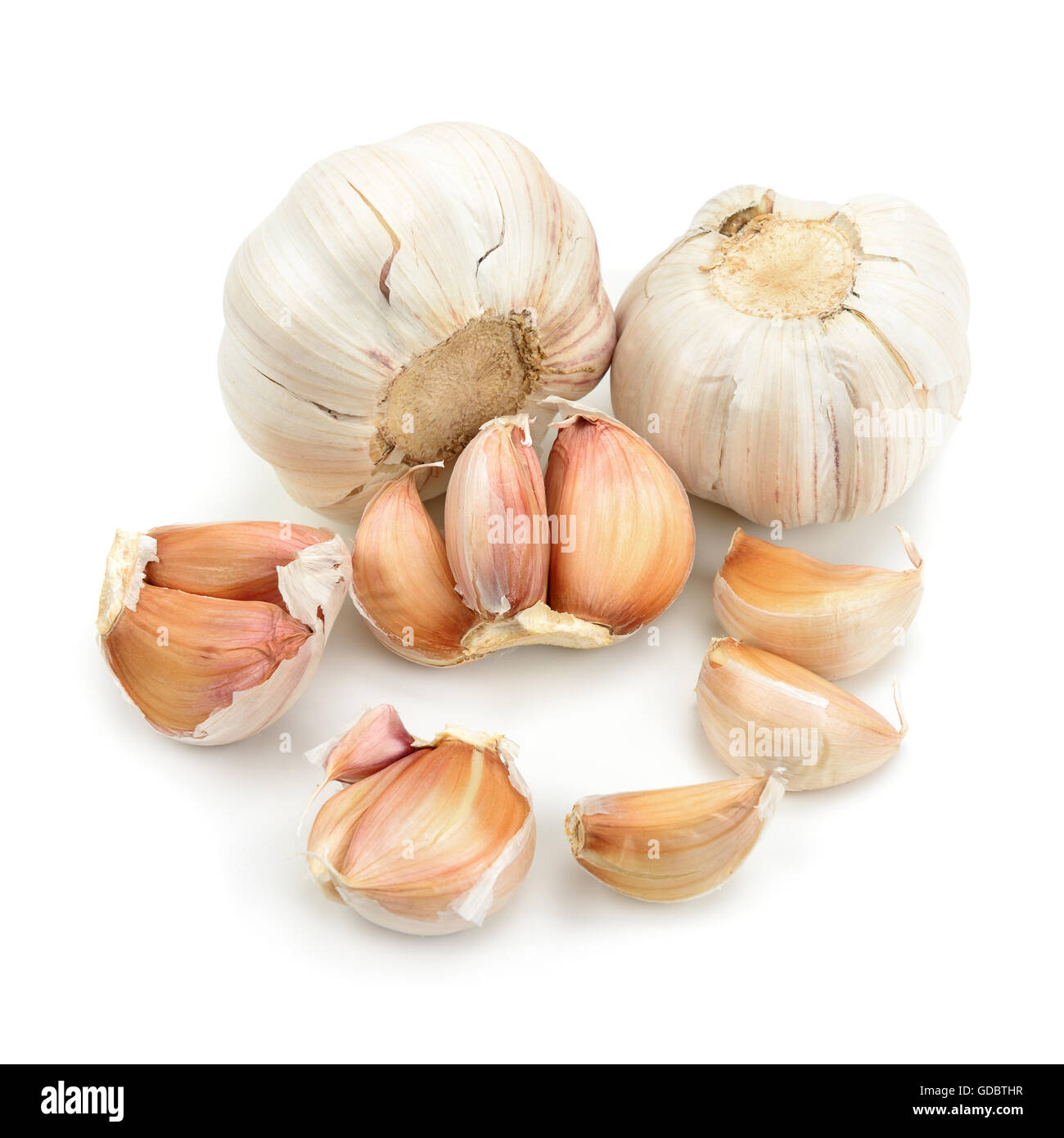 Cloves of garlic isolated on white background Stock Photo - Alamy
