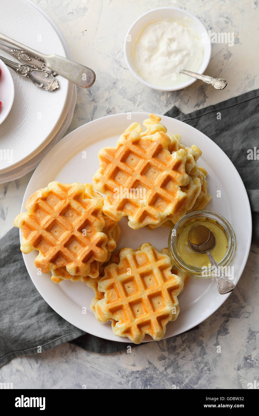 homemade waffles with honey on plate, food top view Stock Photo - Alamy
