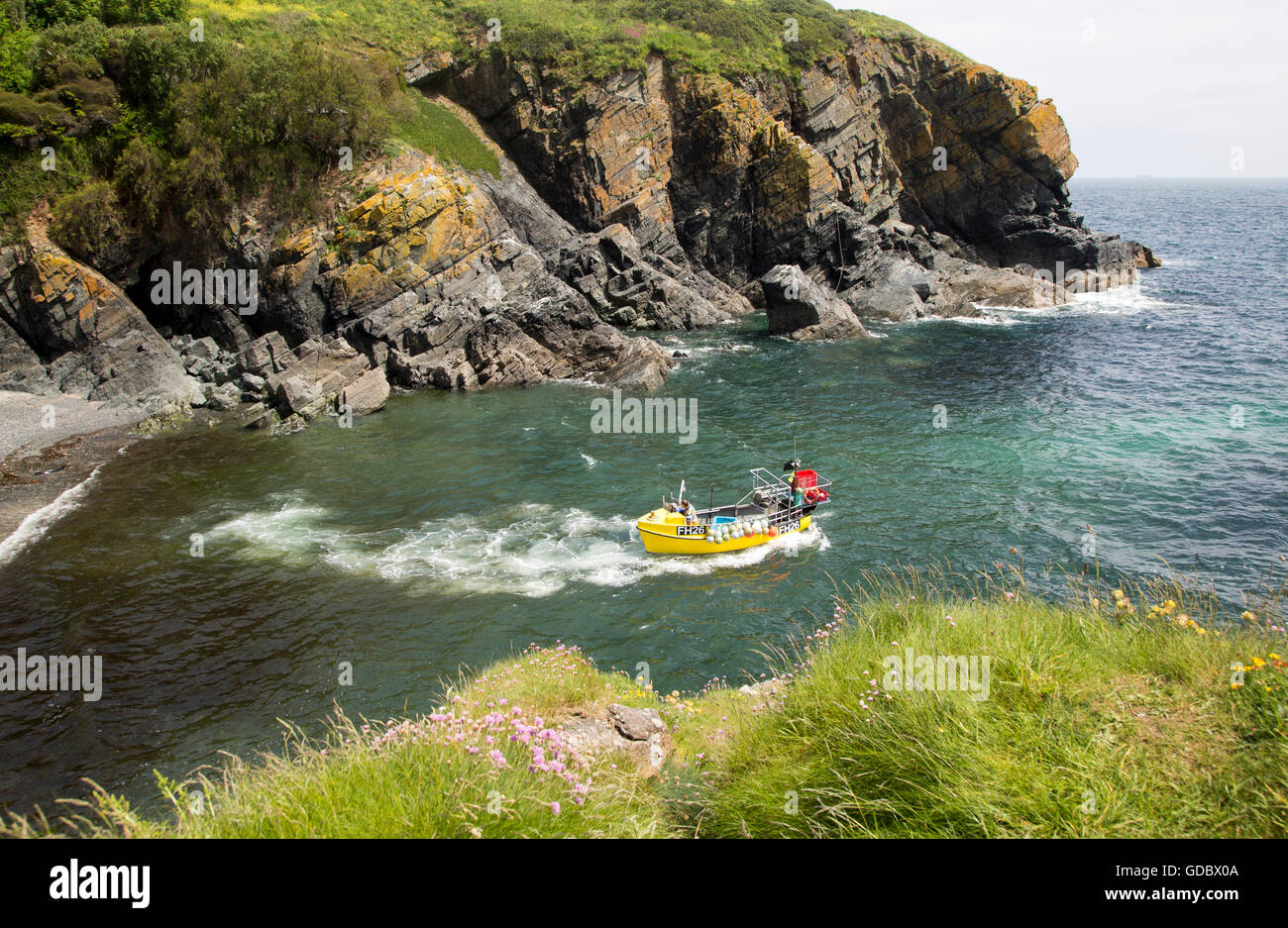Fishing boat in narrow cove Cadgwith, Lizard peninsula, Cornwall ...