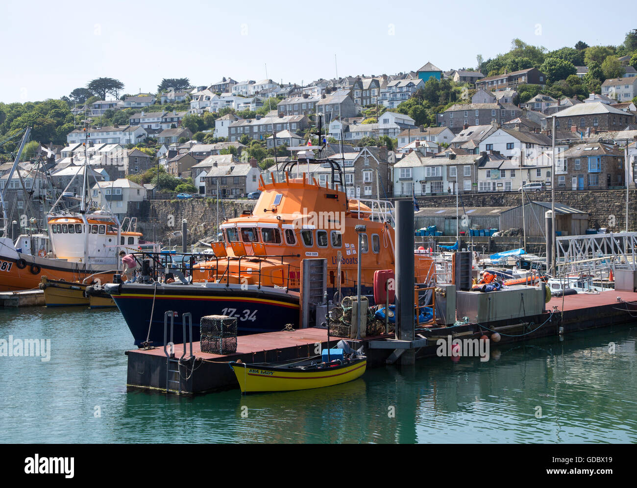 Rnli lifeboat in the harbour of fishing port of newlyn hi-res stock ...