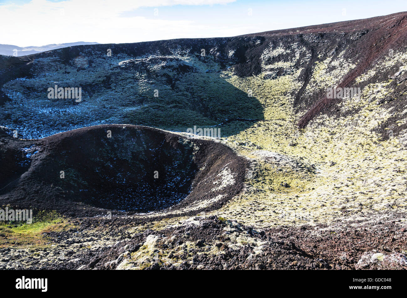 View into the crater of the volcano Grabrok near the village Bifröst in ...