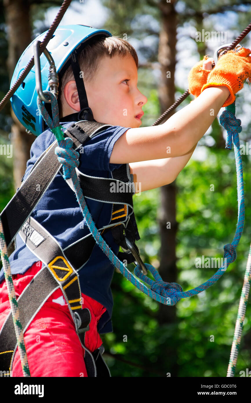 Five year boy on rope-way in forest Stock Photo - Alamy