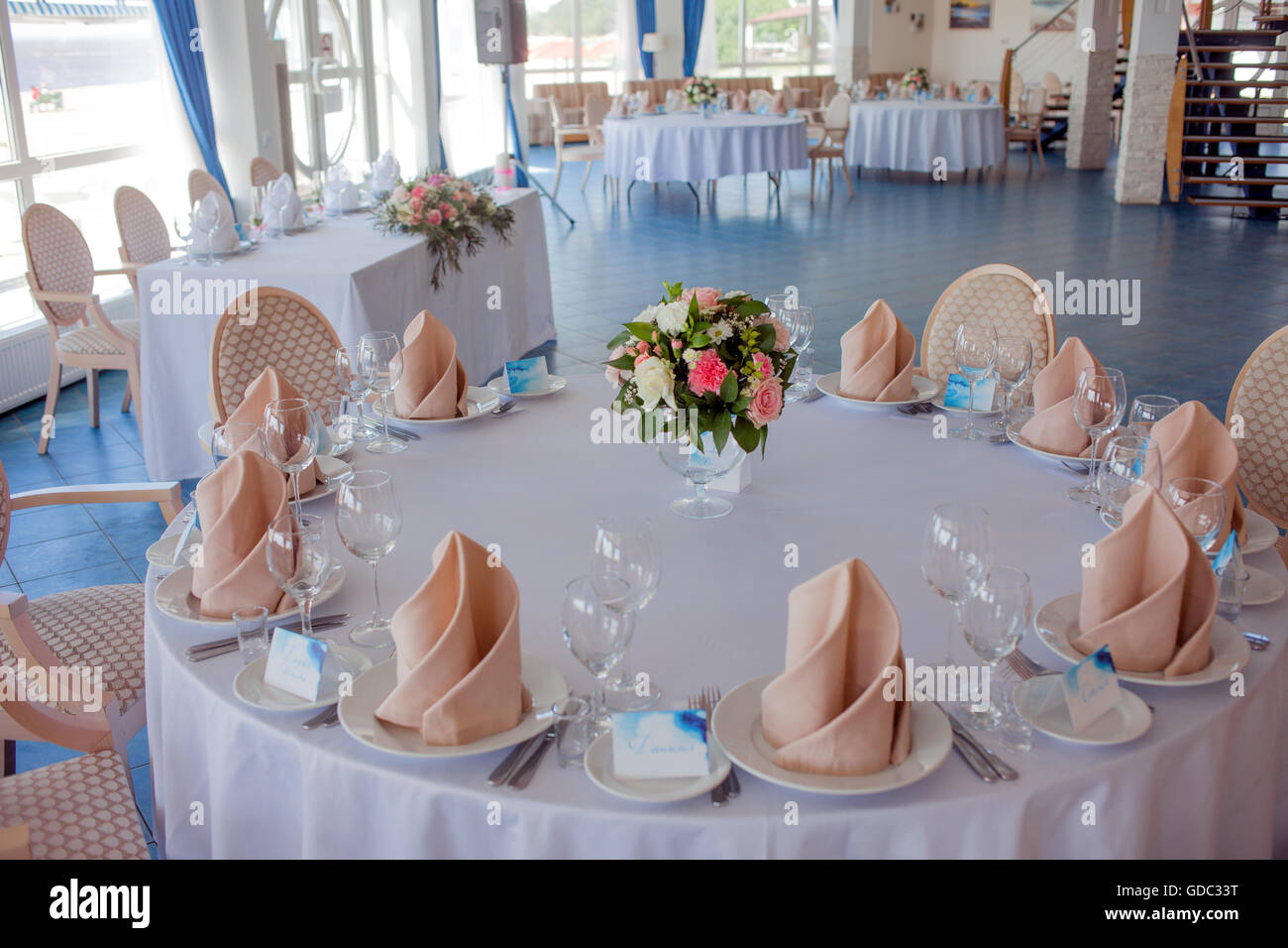Wedding banquet, small restaurant in a Maritime style, round tables ...