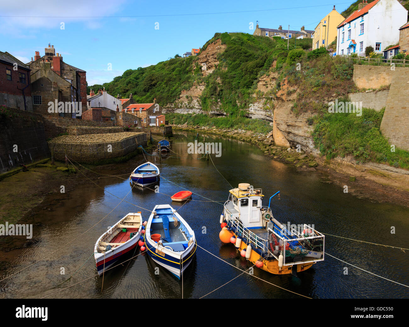 Fishing boats moored up in Staithes beck. In Staithes, North Yorkshire ...