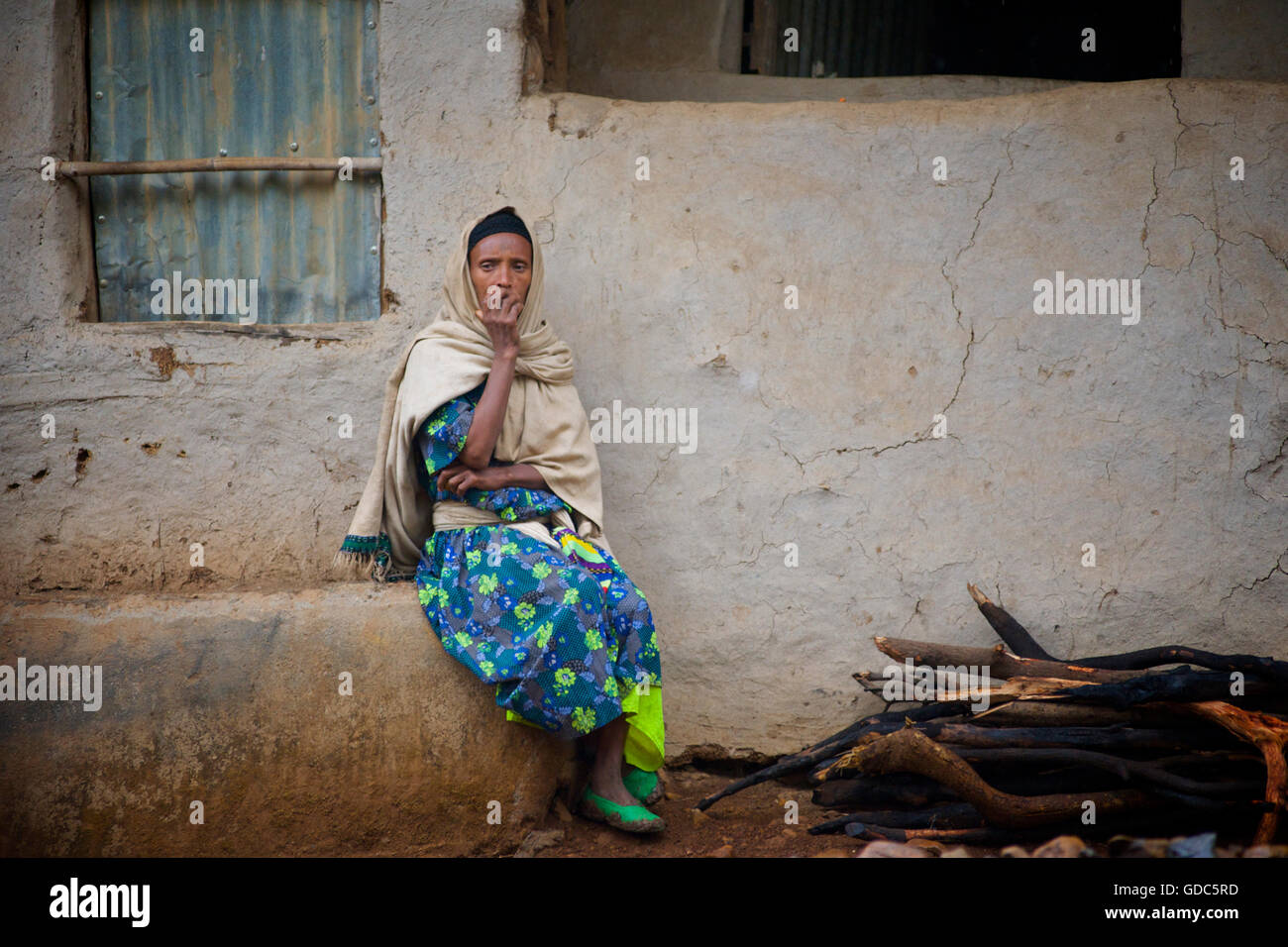 Ethiopian woman sitting outside village home to her home. Near Addi ...
