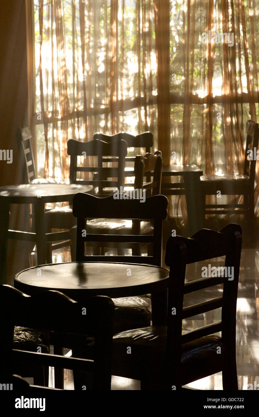 Table and chairs in a dusty bar. Ethiopia Stock Photo - Alamy